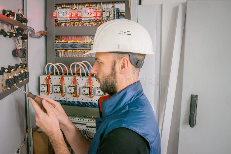 Worker Restores the Connection in the Data Center Server Room. Engineer ...