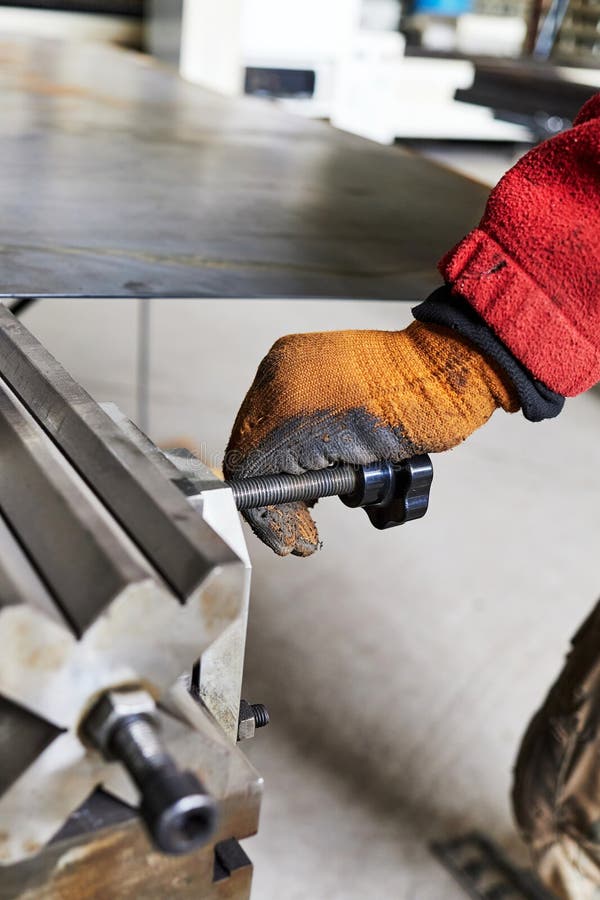 Worker S Gloved Hand on the Adjusting of a Bending Machine Stock Photo ...