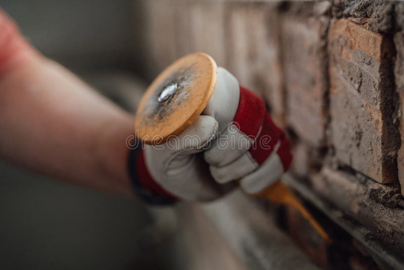 Builder`s Strong Hands Working with Hammer and Chisel at the ...
