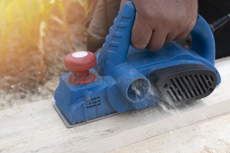Worker is planing boards stock photo. Image of handicraftsman - 337621292