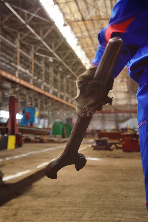 A Worker`s Hand with a Huge Spanner Stock Photo - Image of wrench ...