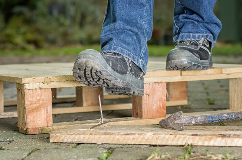 A Worker with Safety Boots Steps on a Rusty Nail Stock Image - Image of ...