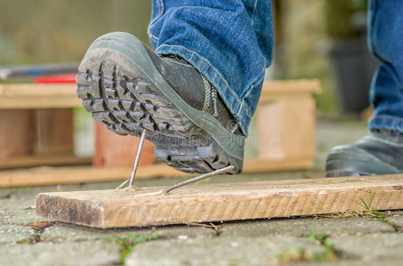 A Worker with Safety Boots Steps on a Rusty Nail Stock Image - Image of ...