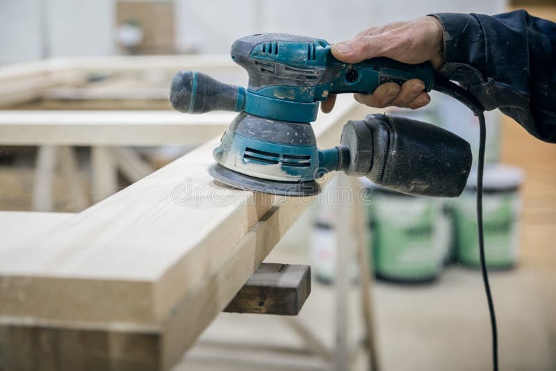 Worker Sanding the Wooden Surface. in the Hand of the Power Tool Stock ...