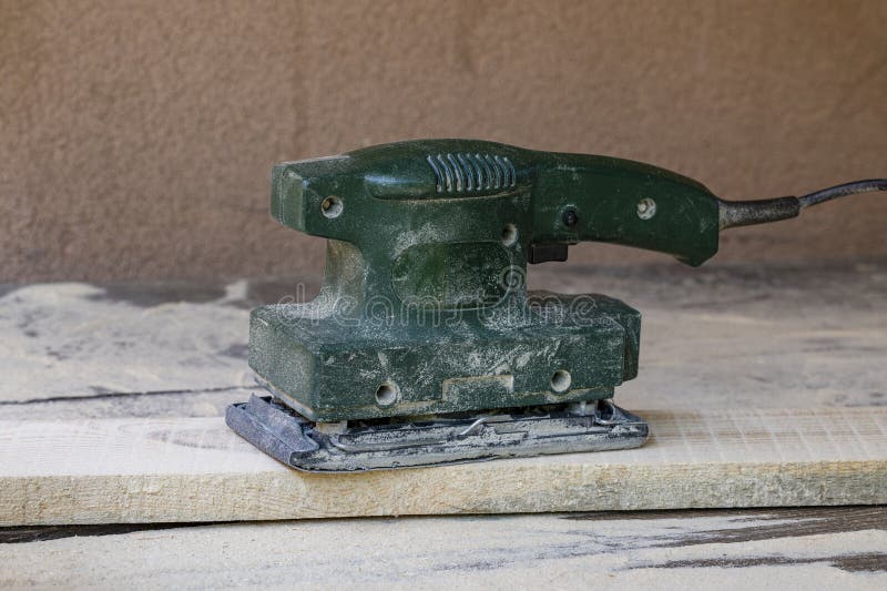 Worker Sands Wooden Boards Using a Vibration Sander in a Workshop ...