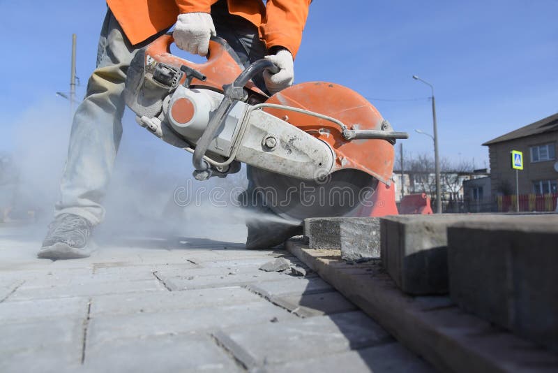 A Worker Saws a Concrete Block. Stock Image - Image of action, builder ...