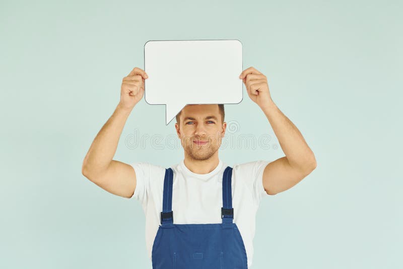 Worker Saying Something. Man Standing in the Studio with Empty Signs ...