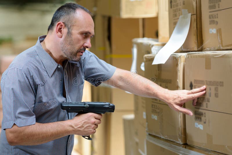 Worker Scanning Barcode Box Stock Photo - Image of boxes, indoors ...