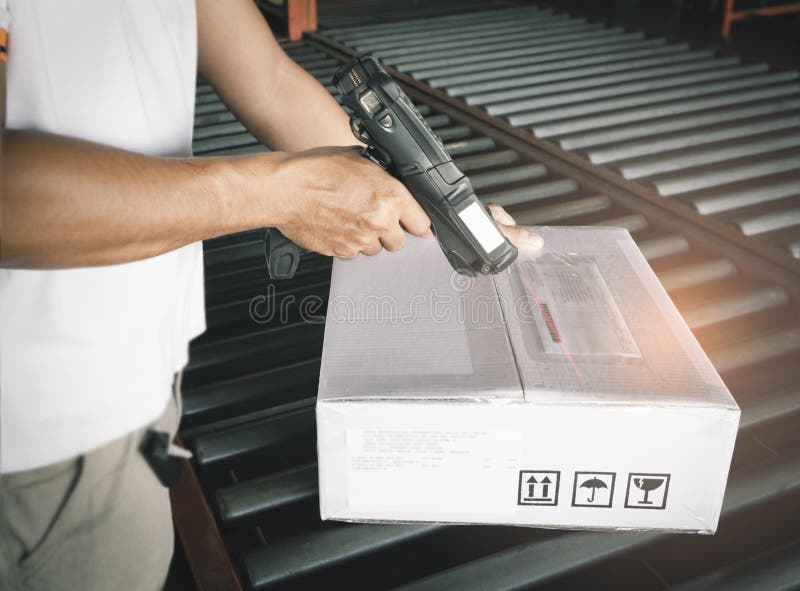 Worker Scanning Barcode Scanner with Red Laser on Parcel Box. Shipment ...