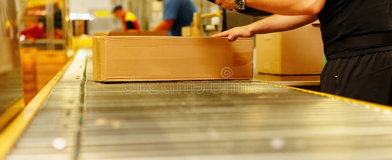 Worker Scanning Box on Conveyor Belt in Warehouse Stock Photo - Image ...