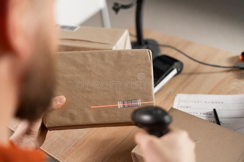 Worker Scanning Package in Warehouse with Barcode Scanner Check Goods ...