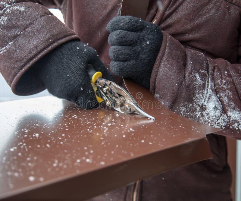 Worker Scissors Metal at a Construction Site Stock Photo - Image of ...