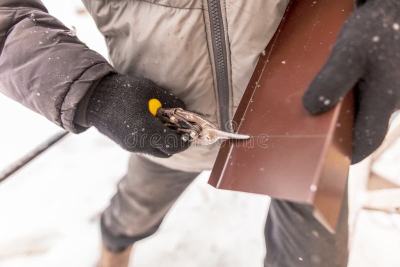 Worker Scissors Metal at a Construction Site Stock Photo - Image of ...