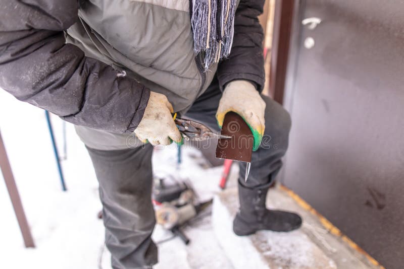 Worker Scissors Metal at a Construction Site Stock Image - Image of ...