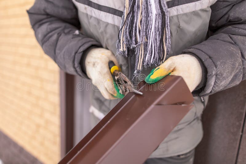 Worker Scissors Metal at a Construction Site Stock Photo - Image of ...
