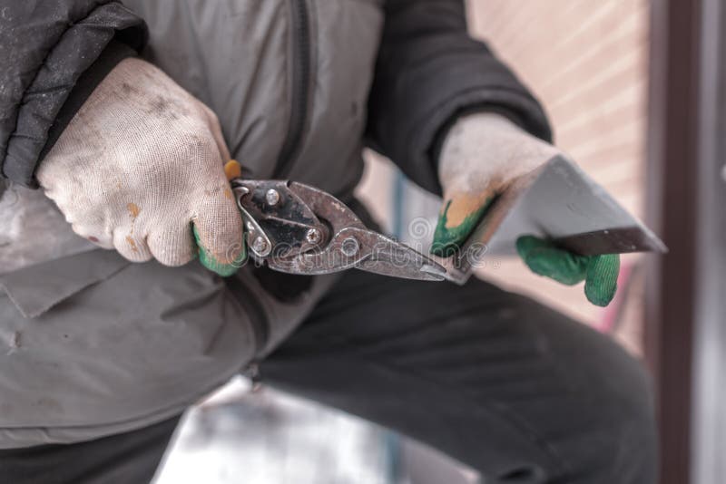 Worker Scissors Metal at a Construction Site Stock Photo - Image of ...