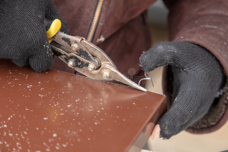 Worker Scissors Metal at a Construction Site Stock Image - Image of ...