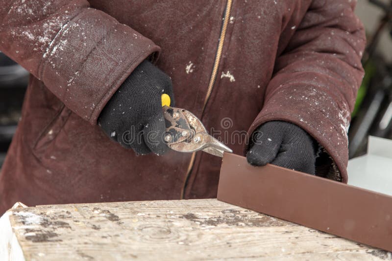 Worker Scissors Metal at a Construction Site Stock Image - Image of ...