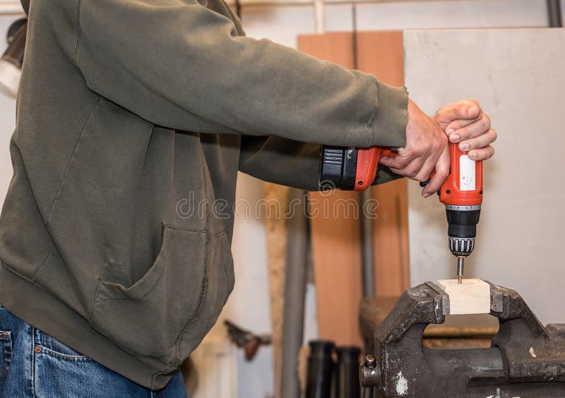 Worker is Screwing a into Wooden Workpiece Stock Image - Image of power ...