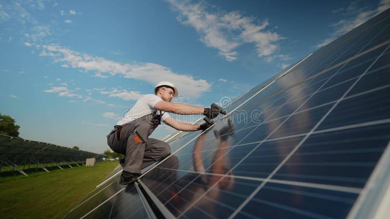 Worker Securing Solar Panels during Maintenance Operation Stock Video ...