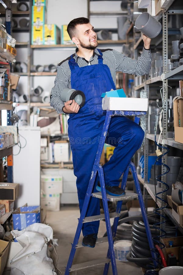 Worker Selects the Details of the Sewer Pipes Stock Photo - Image of ...