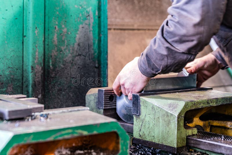 The Worker Sets the Metal Workpiece in a Vice for Processing on a CNC ...