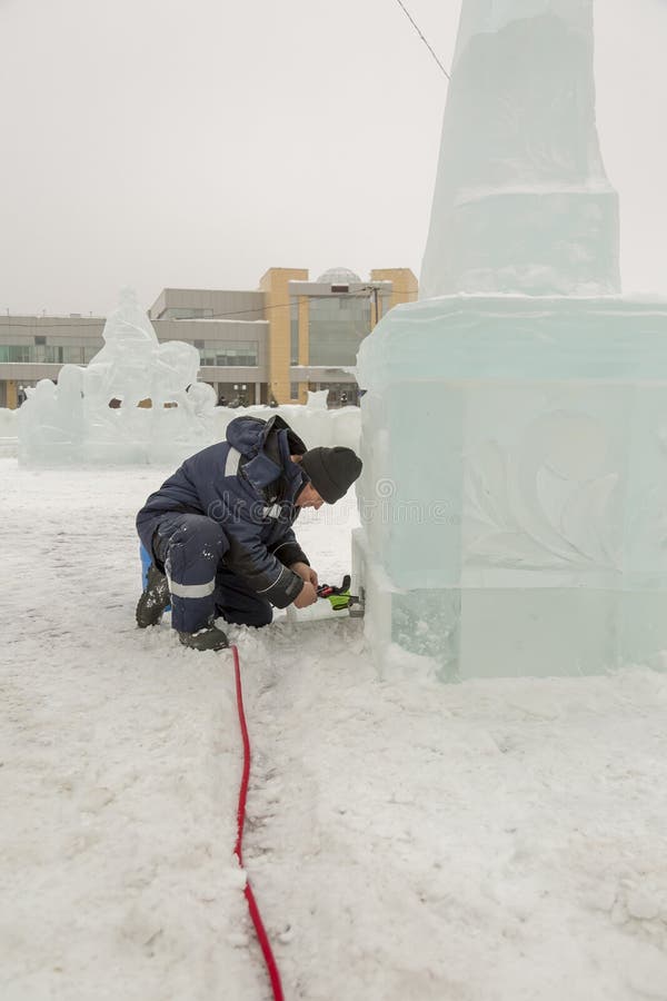 Worker Sets the Spotlight in the Ice Figure Stock Image - Image of ...