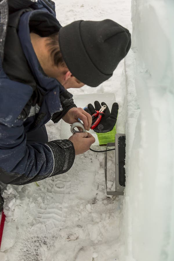 Worker Sets the Spotlight in the Ice Figure Stock Photo - Image of ...