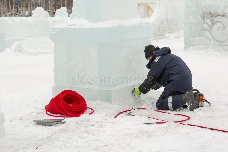 Worker Sets the Spotlight in the Ice Figure Stock Photo - Image of ...