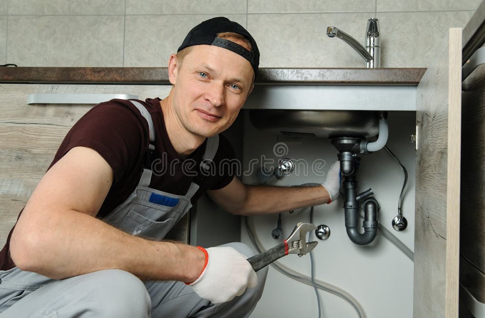 Worker sets trap. stock photo. Image of drain, sanitary - 75307668