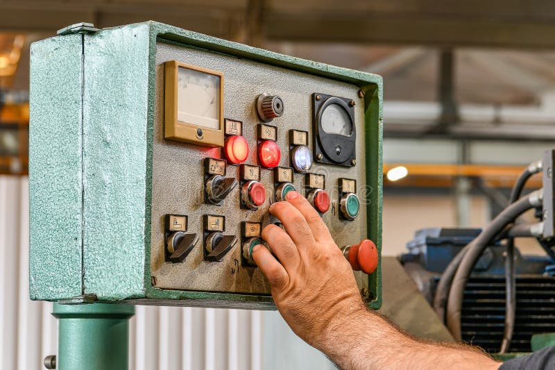 The Worker Sets Up the Control Panel before Working on the Machine ...