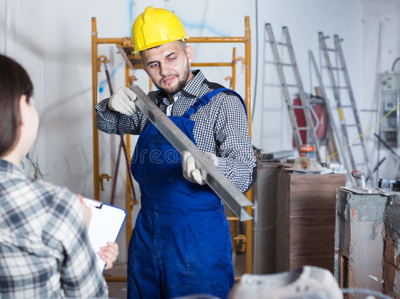 Worker is Showing the Level of the Profile To Client Stock Image ...