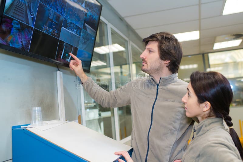 Worker Showing New Colleague Area on Cctv Screen Stock Image - Image of ...