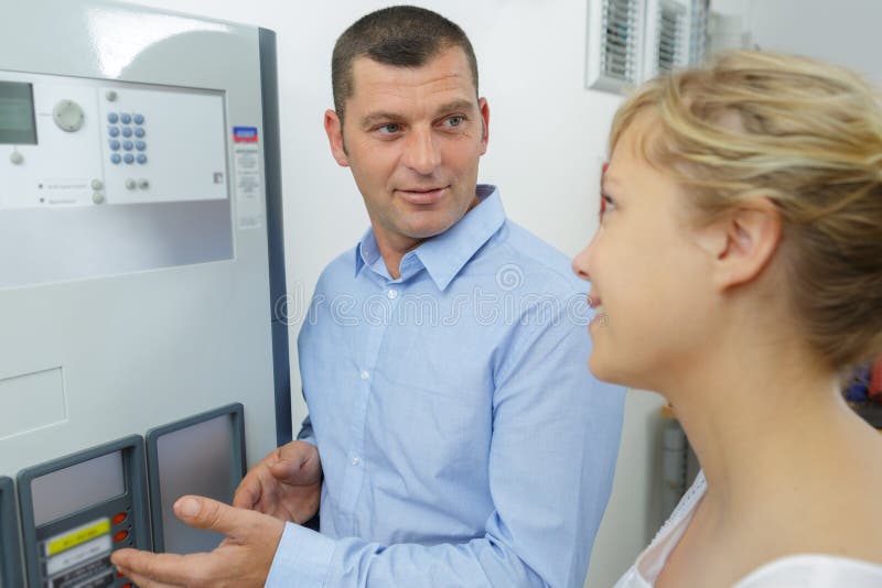 Worker Showing Operator Panel Stock Image - Image of professional ...