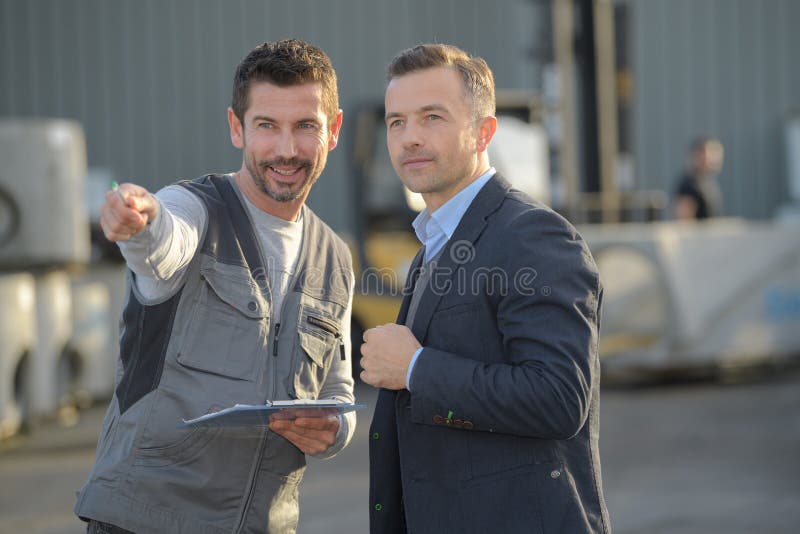 Worker Showing Something To Manager in Industry Stock Photo - Image of ...