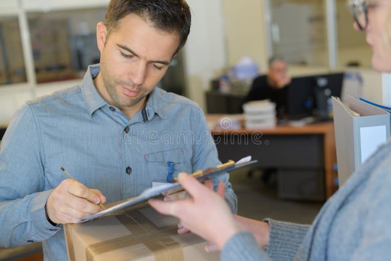 Worker Signing Delivered Box Stock Image - Image of cardboard, signing ...
