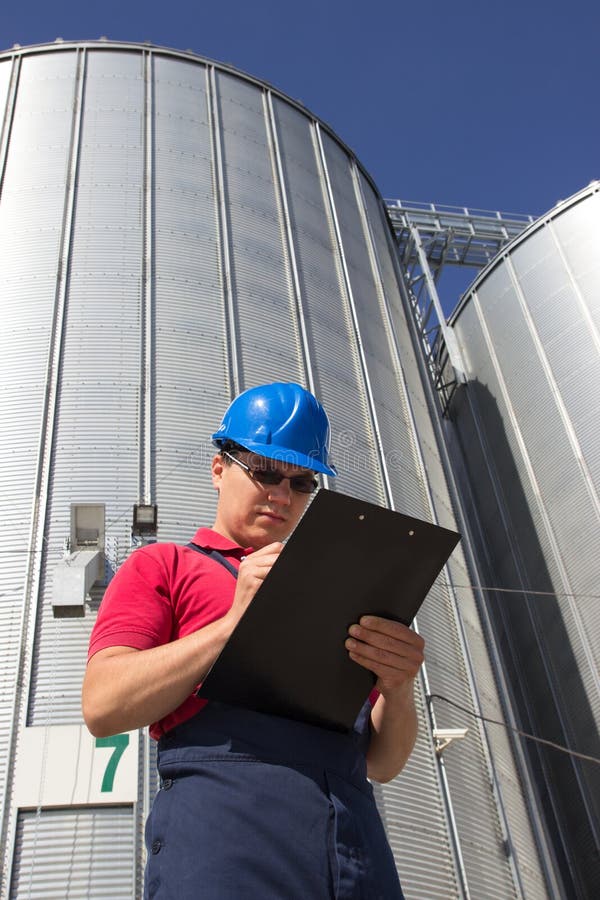 Worker in silo company stock image. Image of laptop, industrial - 31096613