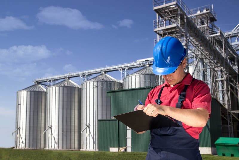 Worker in silo company stock image. Image of laptop, industrial - 31096613