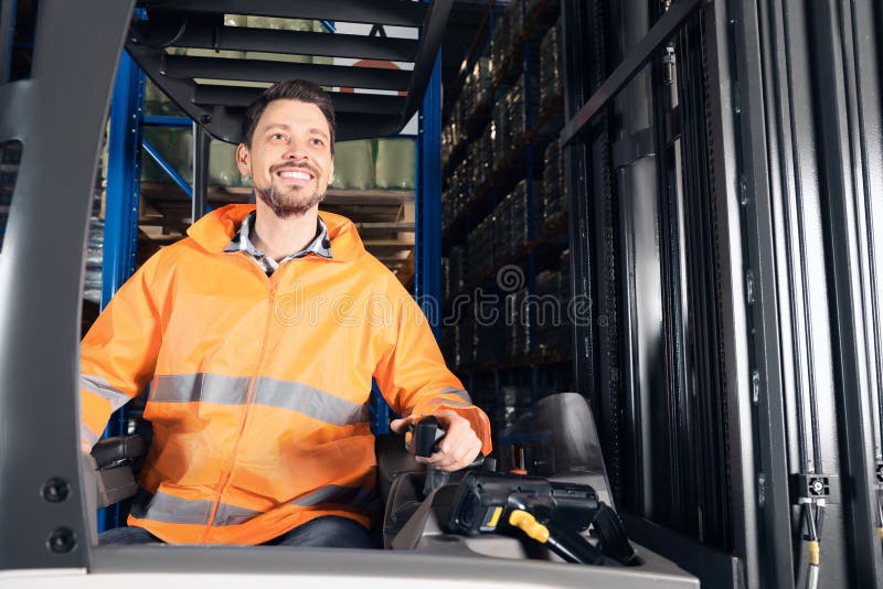 Happy Worker Sitting in Forklift Truck at Warehouse Stock Image - Image ...