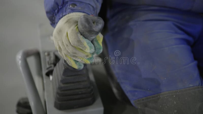 A Worker is Skillfully Operating Heavy Machinery Controls in an ...