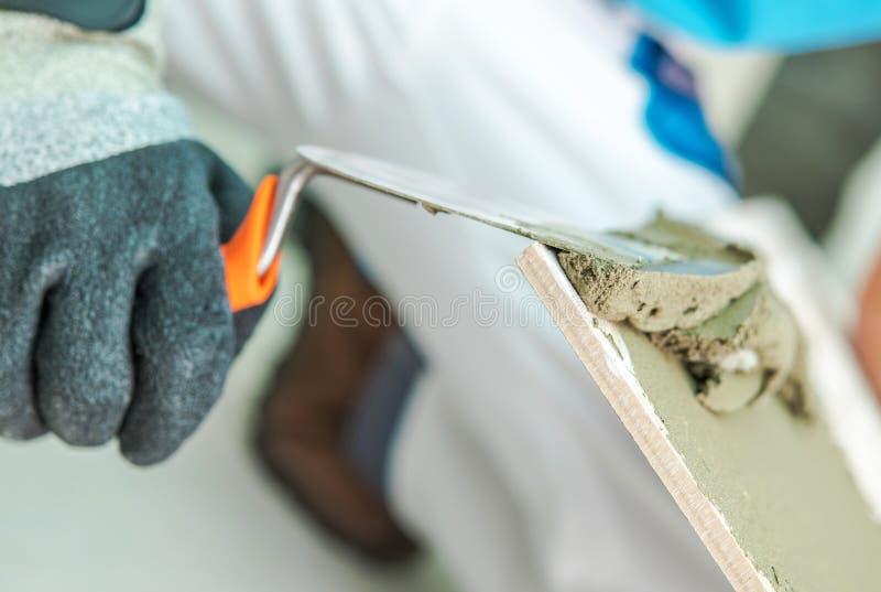 Worker Applying Plaster with a Trowel during Renovation in a Home ...
