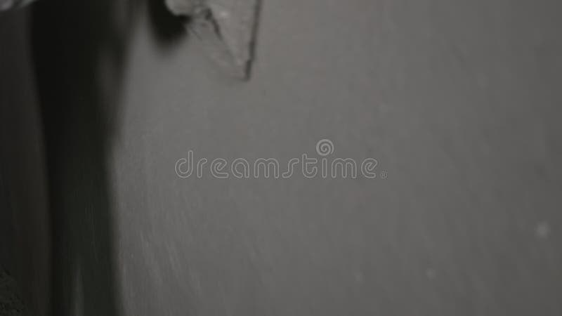 Worker Smoothing Plaster on a Wall, Close-up of a Worker Using a ...
