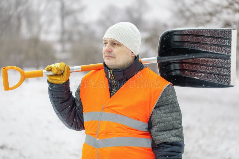 Worker with Snow Shovel Near Tanks in Winter Stock Image - Image of ...