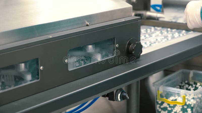 Worker Control the Process of Sorting Capsules into Packages Stock ...