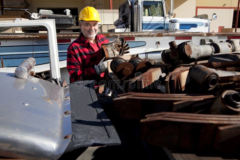 Worker Sorting Scrap Metal in Front of Cargo Truck Stock Photo - Image ...