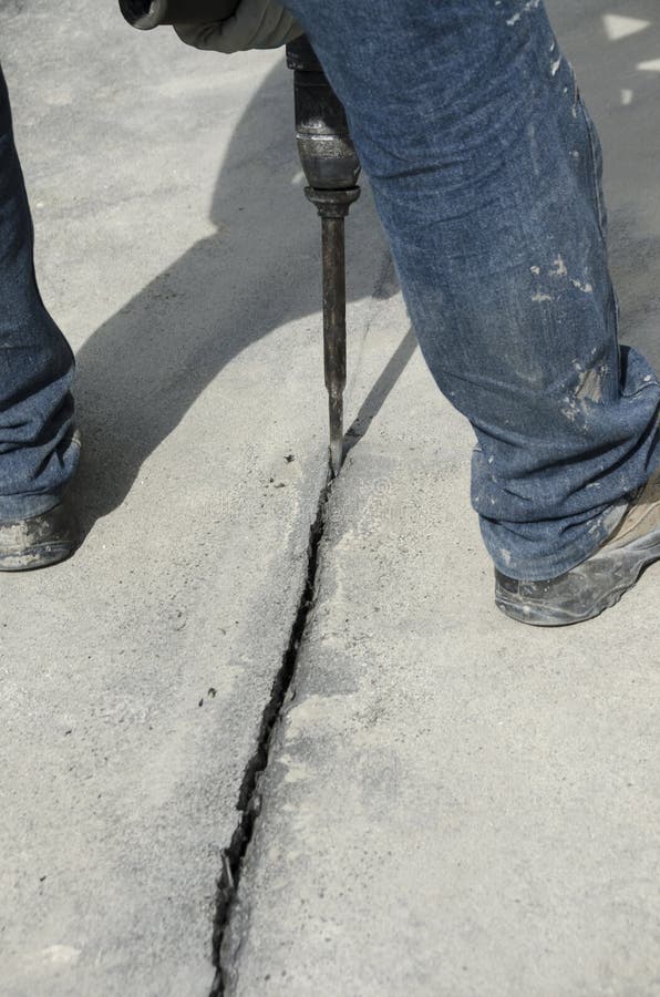 Worker while Splitting the Concrete with the Jackhammer Stock Image ...