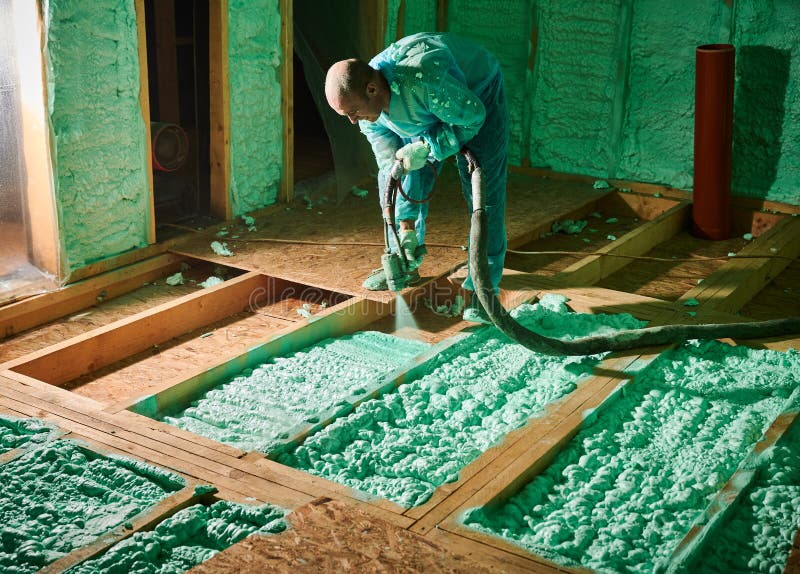 Worker Spraying Polyurethane Foam for Insulating Wooden Frame House ...