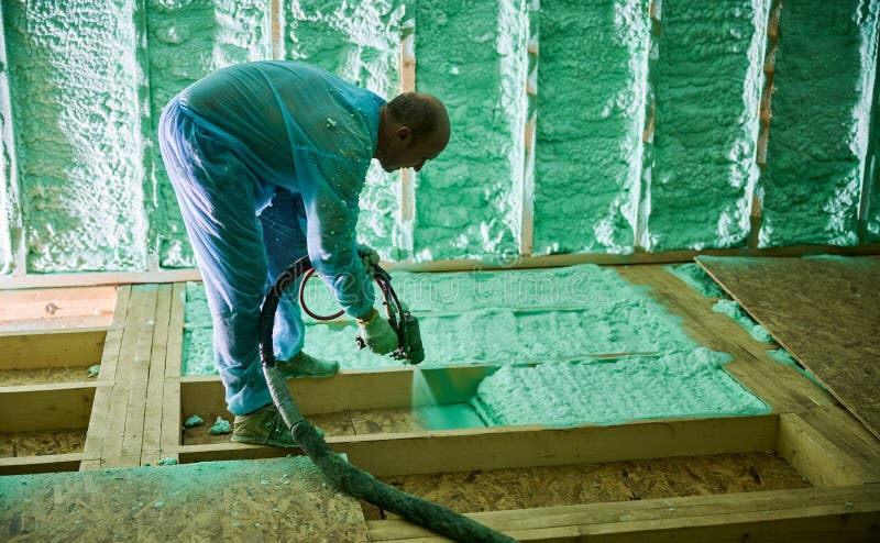 Worker Spraying Polyurethane Foam for Insulating Wooden Frame House ...