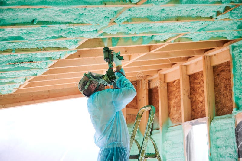 Worker Spraying Polyurethane Foam for Insulating Wooden Frame House ...