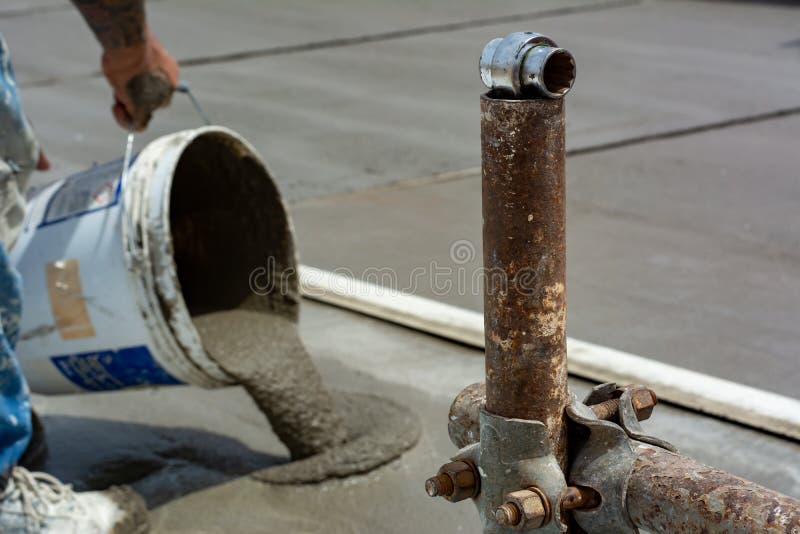 Worker Spreading Building Screed on a Floor of a House during Energy ...